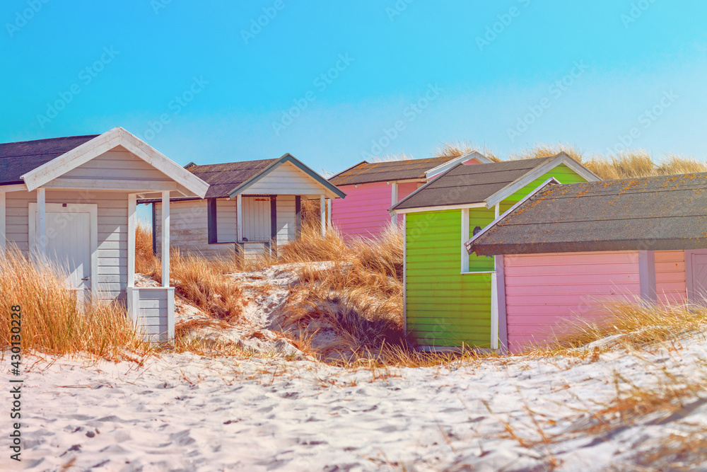 Beach huts, colourful wooden houses on the beach. North Sea, Falsterbo ...