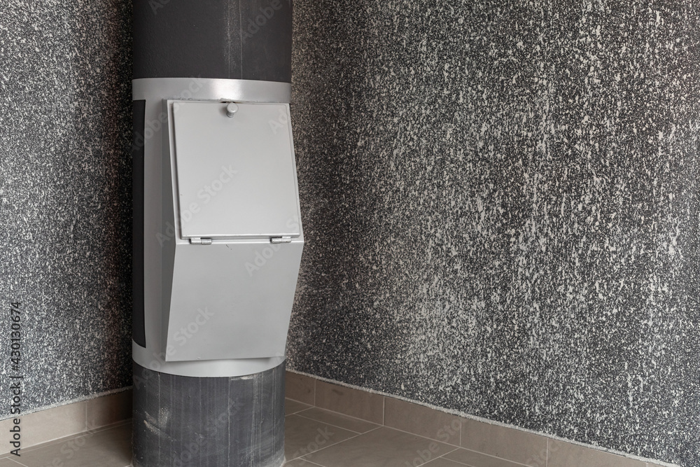 Waste disposal container installed on the floor of a multi-storey ...