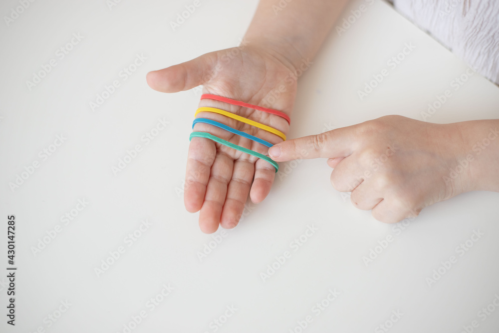 Child make fine motor activity for building hand strength , using ...