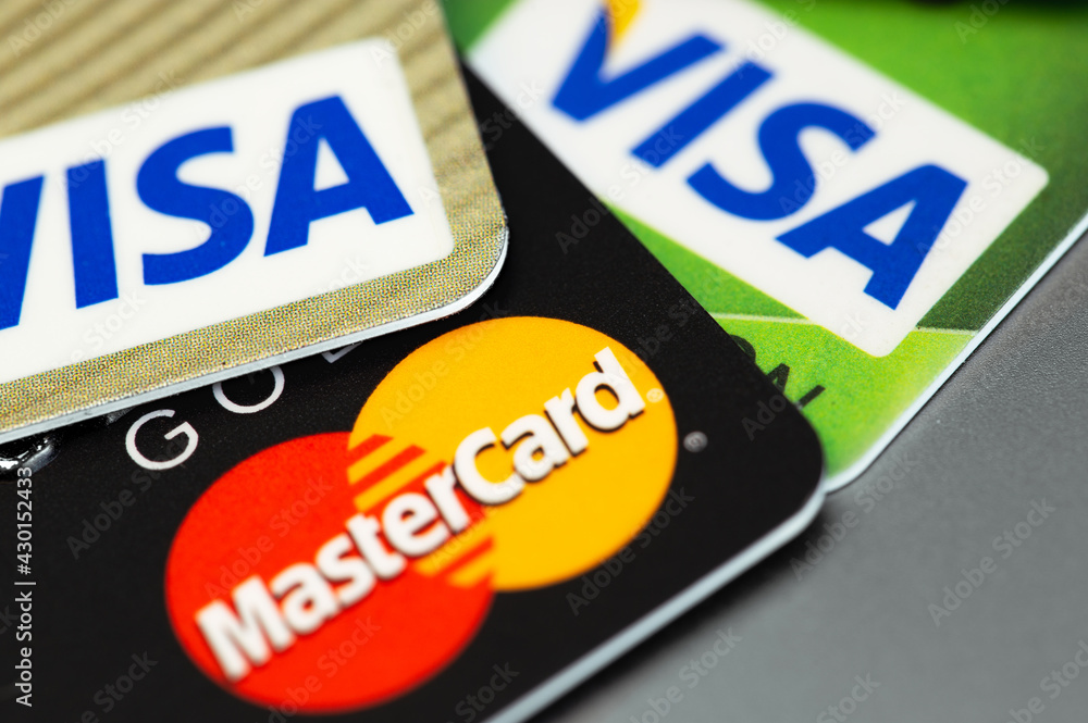 Visa and MasterCard logo on plastic electronic cards macro. Visa and ...