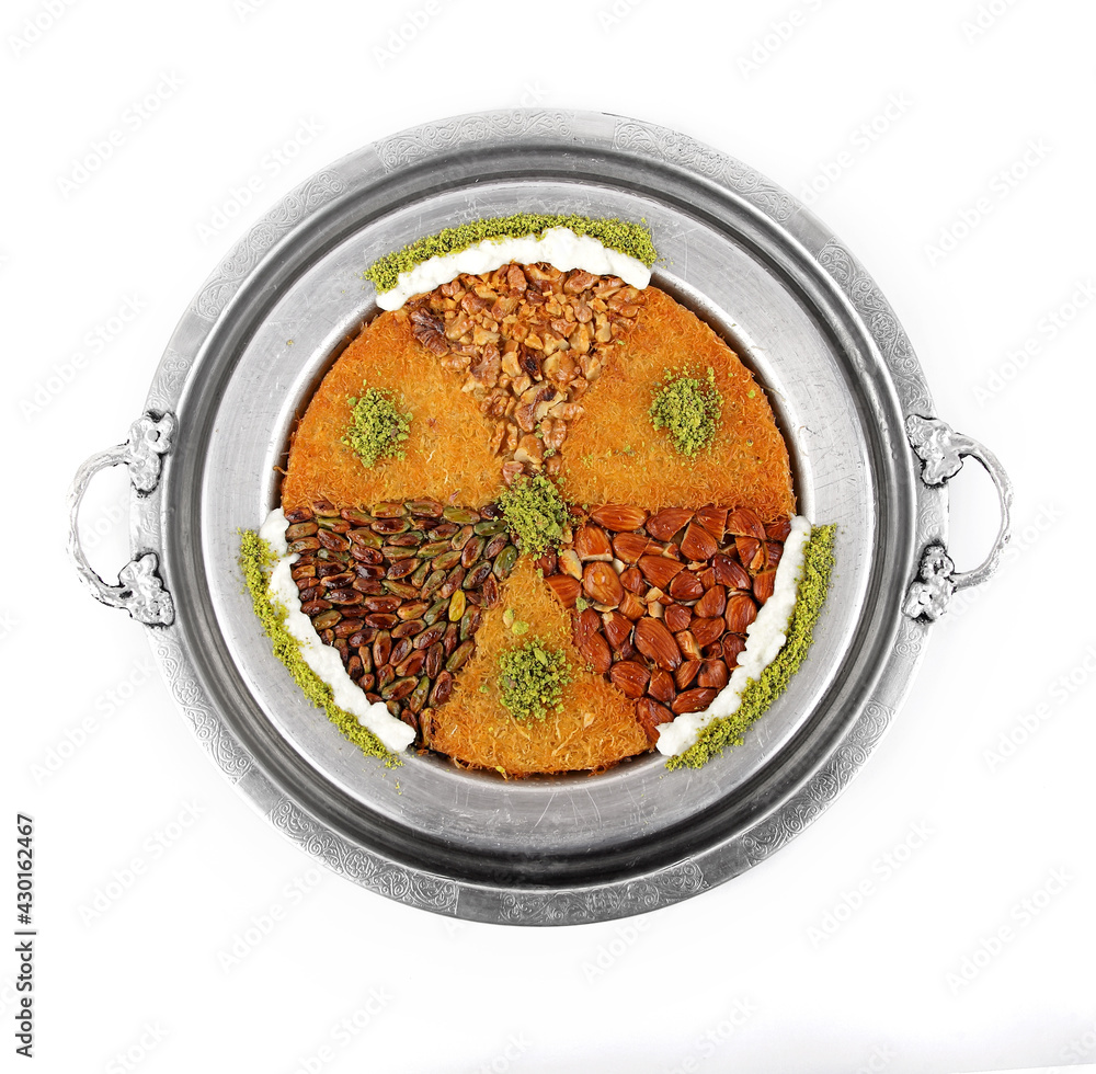 Turkish dessert kunefe, kunafa, kadayif with pistachio powder and ...