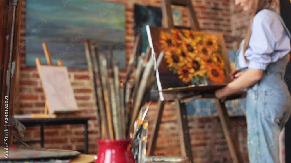 Working process in art studio. Set of painting brushes and palette ...