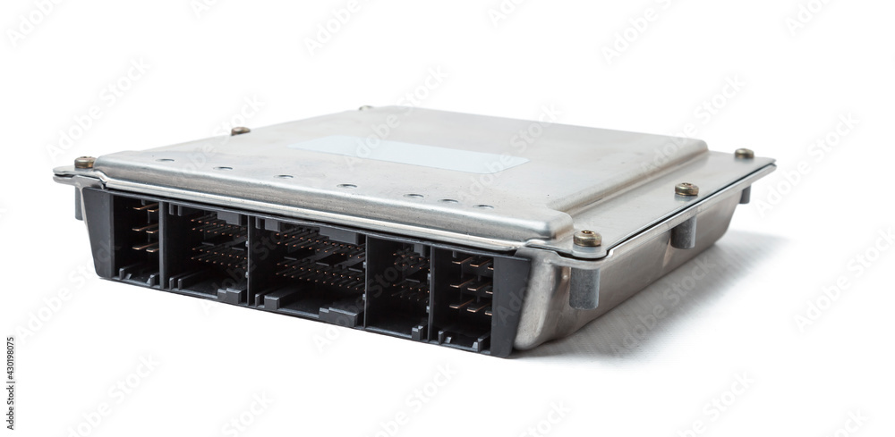 Metallic car engine control unit with plastic elements on a white ...