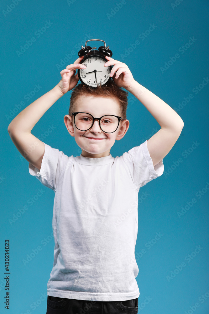 Time management. Morning. little boy with alarm clock. Happy childhood ...