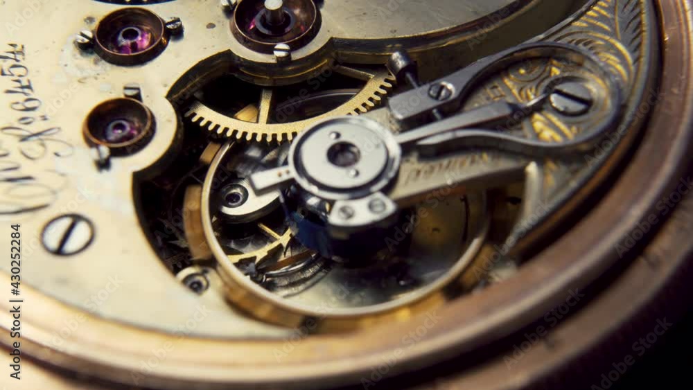 Rotating gears inside a vintage watch mechanism Stock Video | Adobe Stock