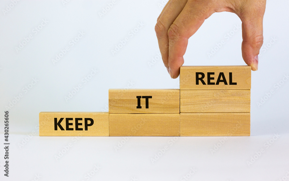 Keep it real symbol. Businessman placing a blocks with word 'keep' on ...