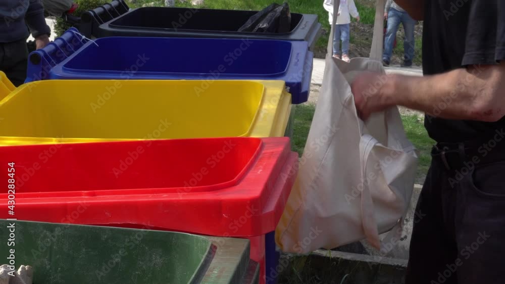 Colorful bins for sorting garbage on the street. Collection, recycling ...