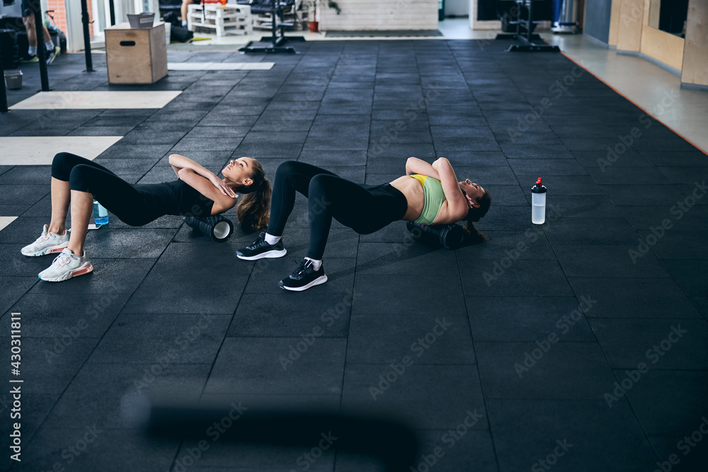 Professional female athletes relaxing their upper back muscles Stock ...