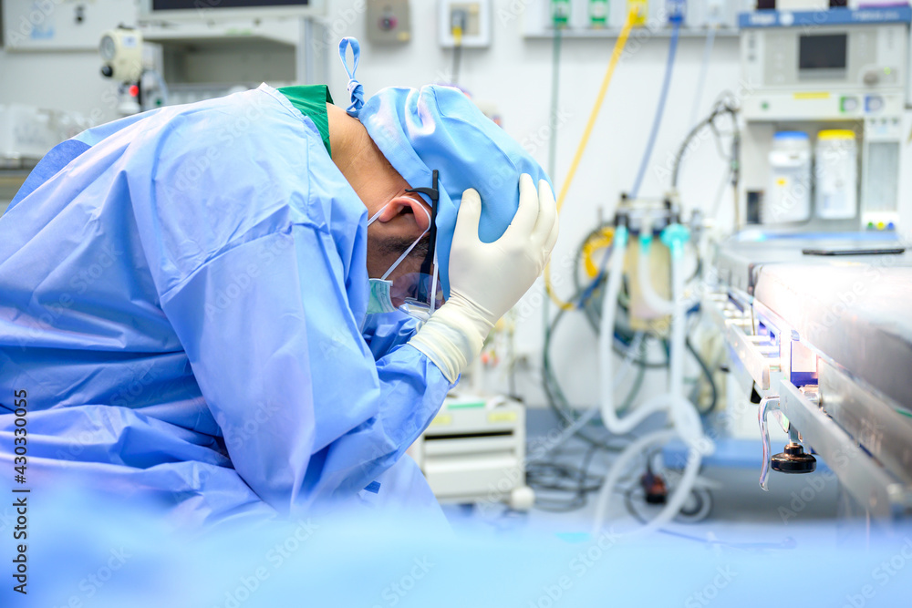 Foto de Male doctor sitting sad and feeling stressed I was disappointed ...