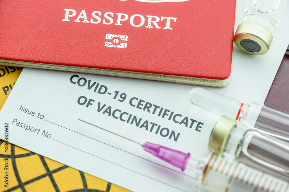 Top view of COVID-19 certificate of vaccination, a record proving a ...