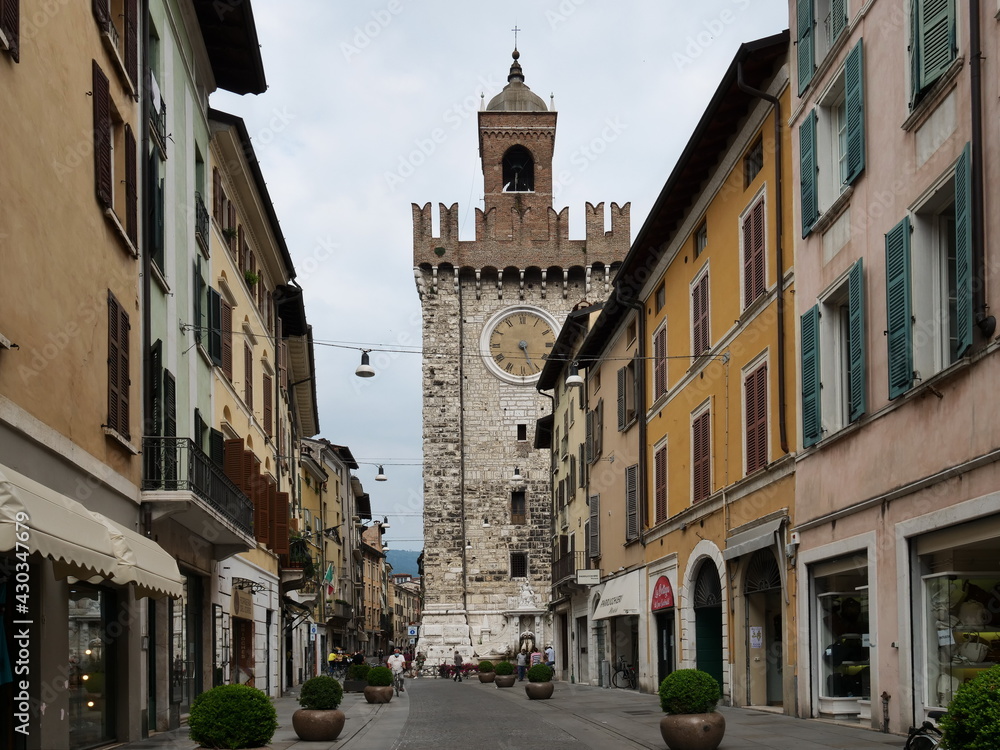 Torre della Pallata brick medieval clock tower building with merlons in ...