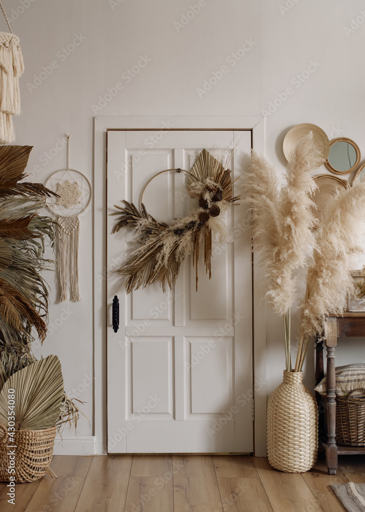 Light boho style interior. White door and wall. Beige. Beautiful decor ...