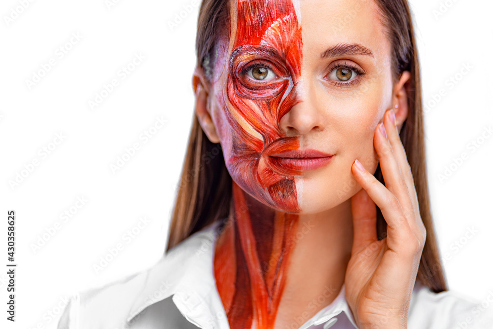 Young woman with half of face with muscles structure under skin. Model ...