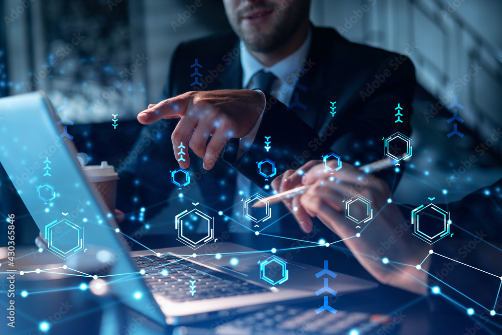 Two colleagues in formal wear working together to optimize business ...