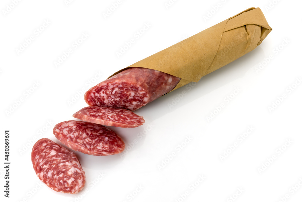 Italian salami, whole sausage cut wrapped in butcher paper with slices ...