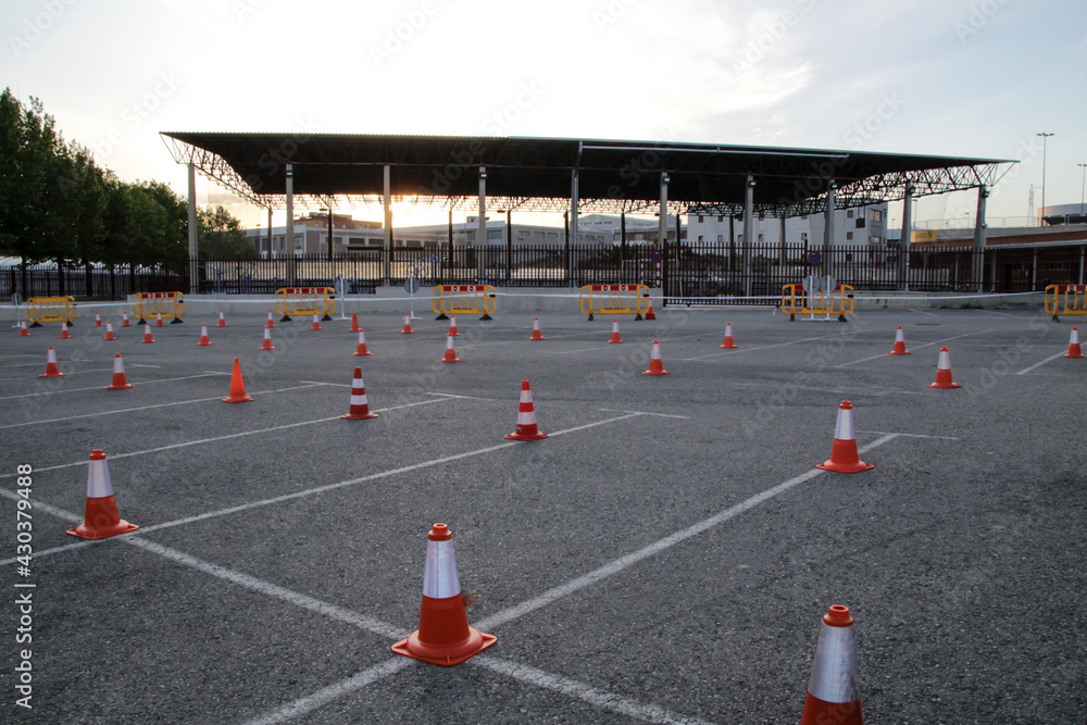 Traffic cones placed in row on asphalt Stock Photo | Adobe Stock