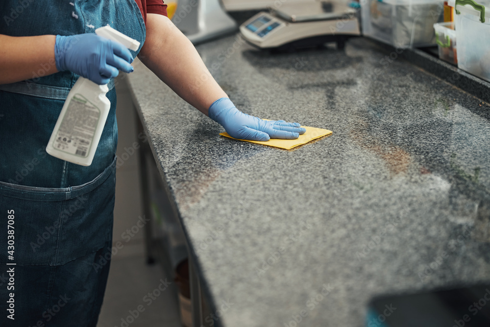 Responsible kitchen staff cleaning and desinfecting work surfaces Stock ...