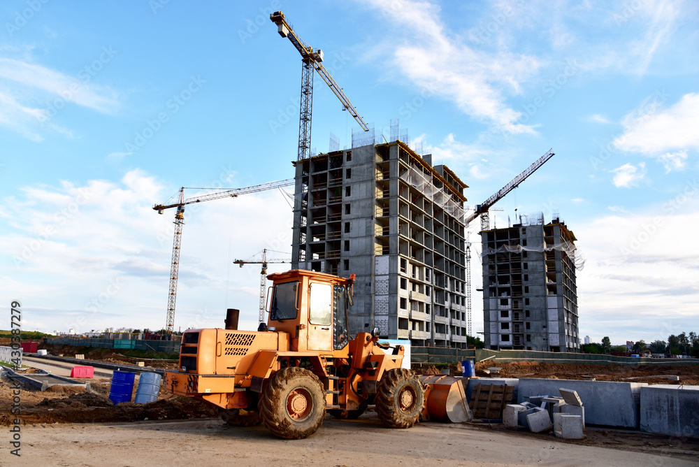 Wheel loader with a bucket at construction. Heavy machinery for loading ...