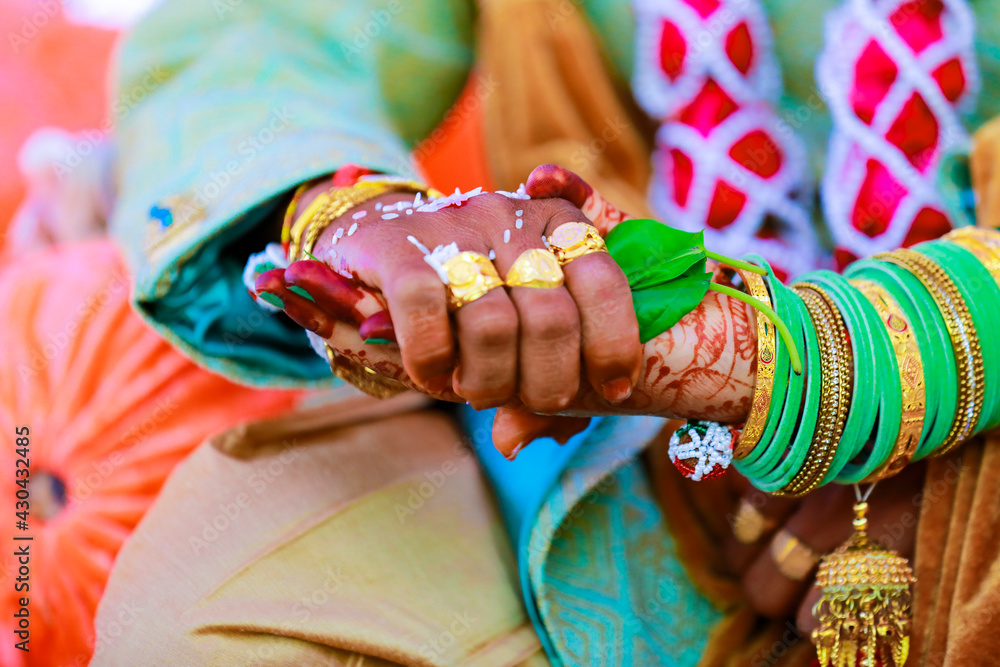 Traditional indian wedding ceremony, groom holding hand in bride hand ...