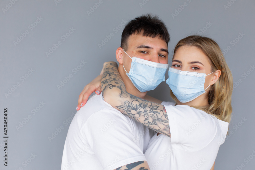 Man and woman wearing face mask standing from each other keeping social ...