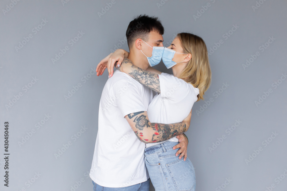 Man and woman wearing face mask standing from each other keeping social ...