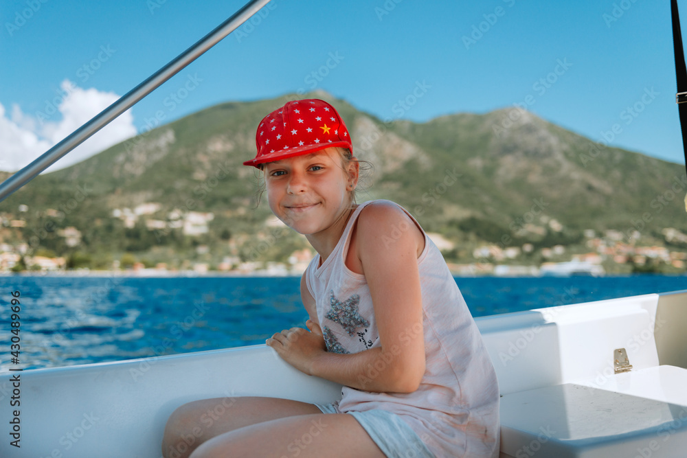 beautiful girl on speed boat in Greece. Little girl on a private yacht ...