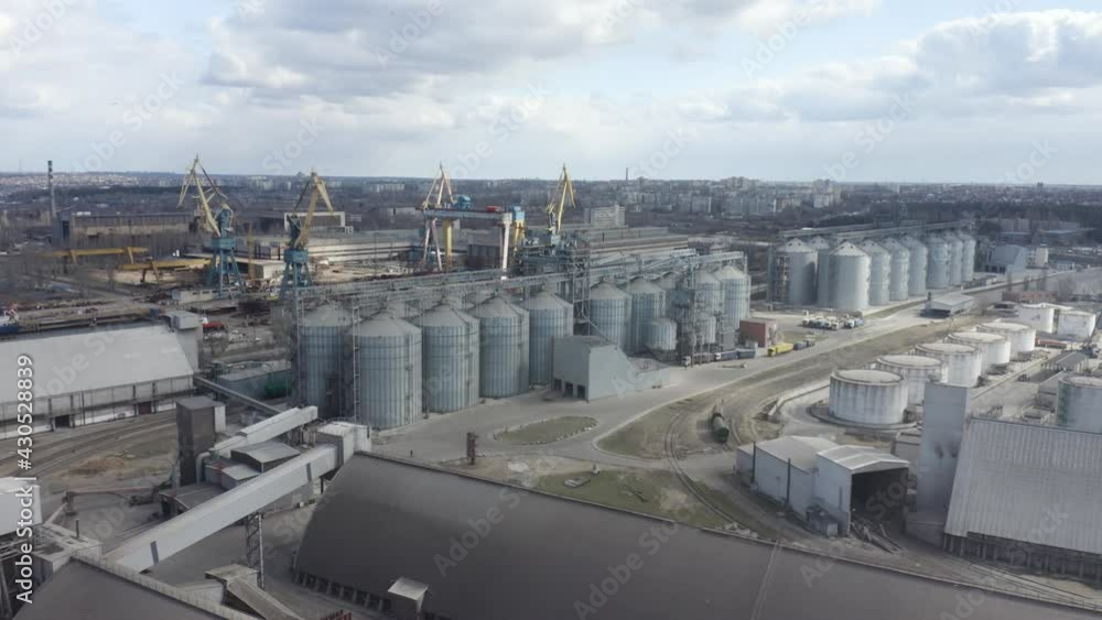 Grain elevator and silos near the river aerial view. Aerial view large ...