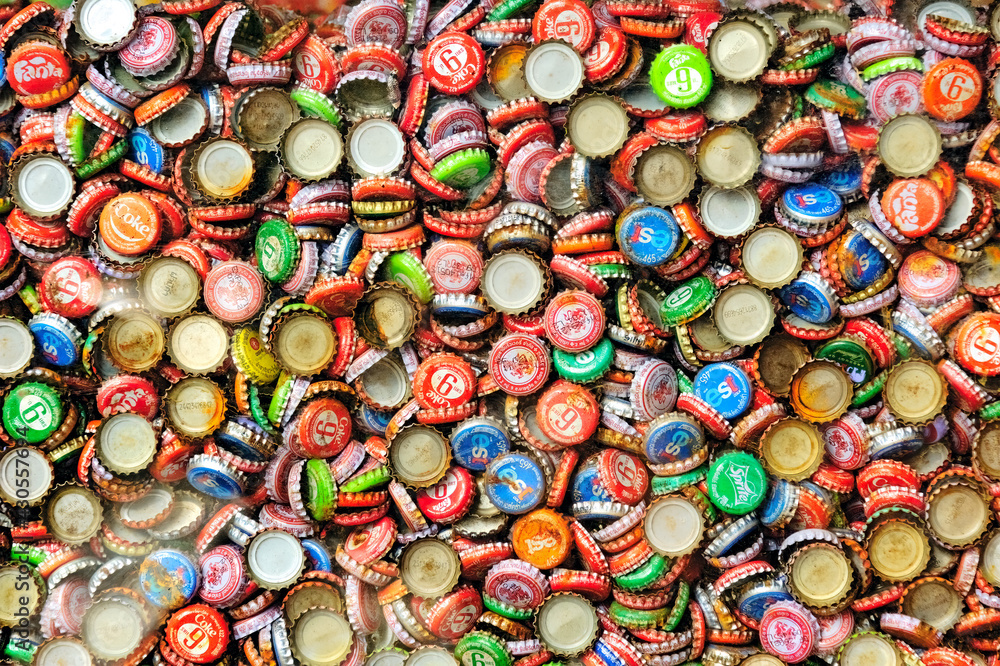 Collection of Bottle caps decorated with logos of many brand beverages ...