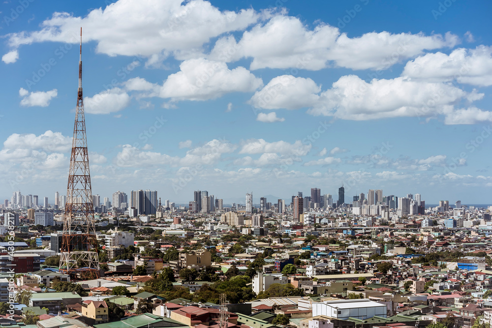 Quezon City, Philippines - A tall transmission tower and the Metro ...