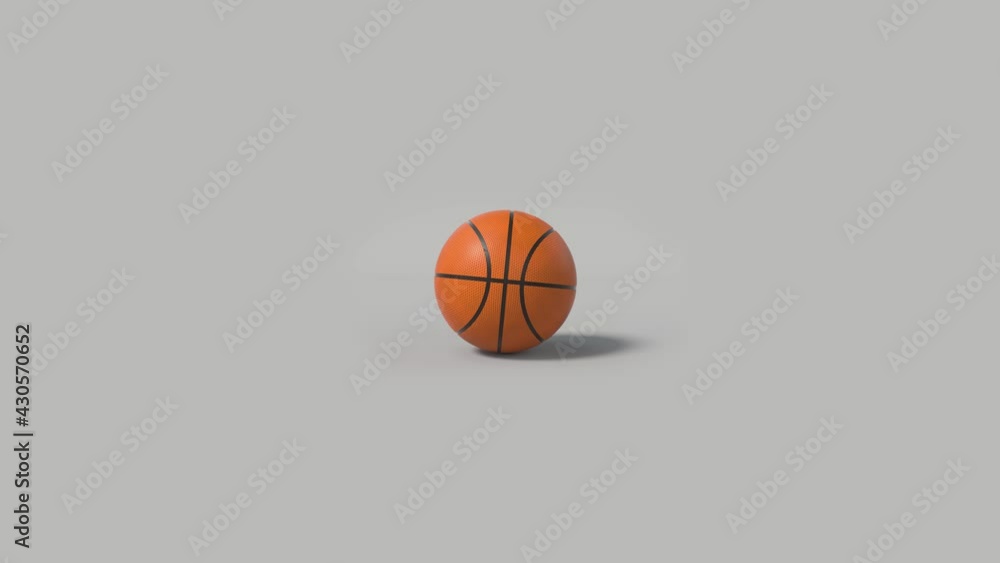 Side on view of a 3D basketball rolling from right to left. Standard ...