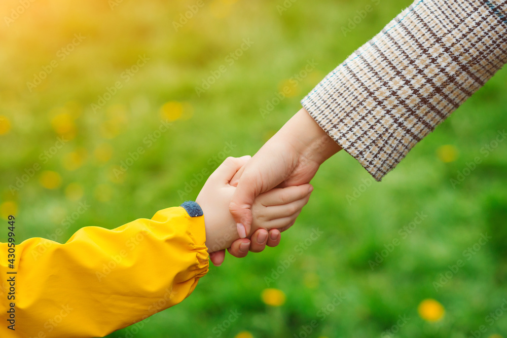 Mother and child hands reaching to each other. Support, help and trust ...