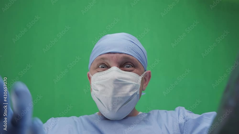 Crazy doctor closes the plastic bag with a dead body inside. Hospital ...