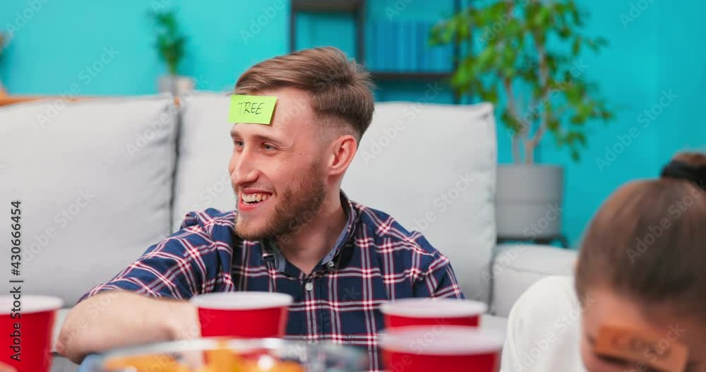 Diverse Group of Fun Loving Friends Playing Who am I game With Sticky ...