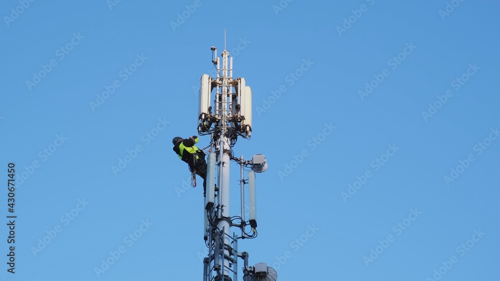 Telecommunication Technician Working at Height Fixes Transmitter Relay ...