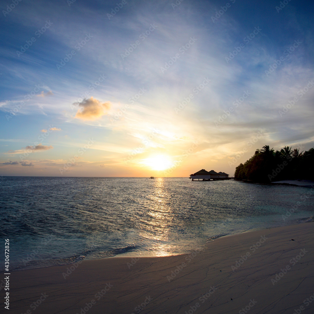 Sunrise early in the morning on the beach of Embudu in the Maldives ...