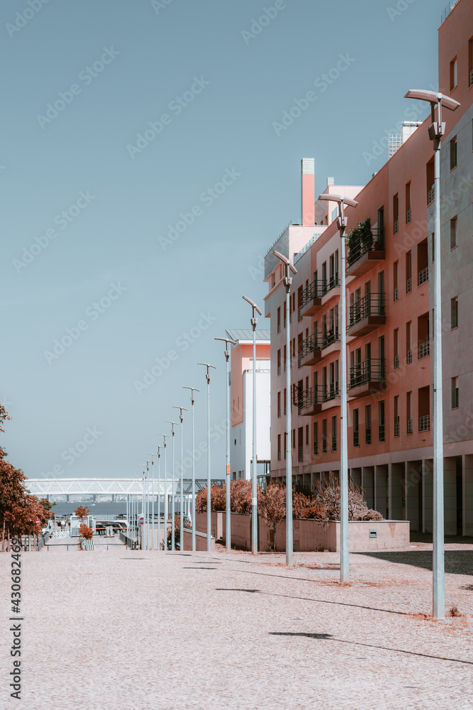 A vertical view of a city street on a sunny day with a clear blue sky ...