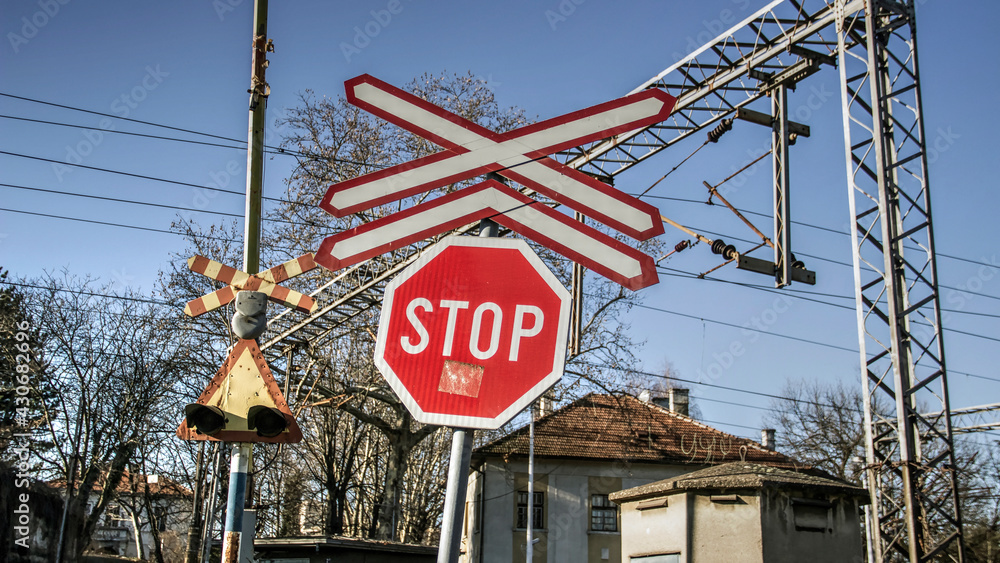 Traffic signs in front of a railroad crossing intersection Stock Photo ...
