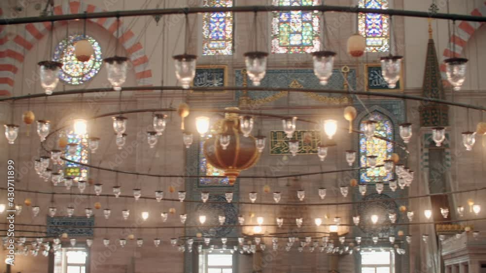 Majestic interior of ancient mosque with stained glass. Illuminated ...