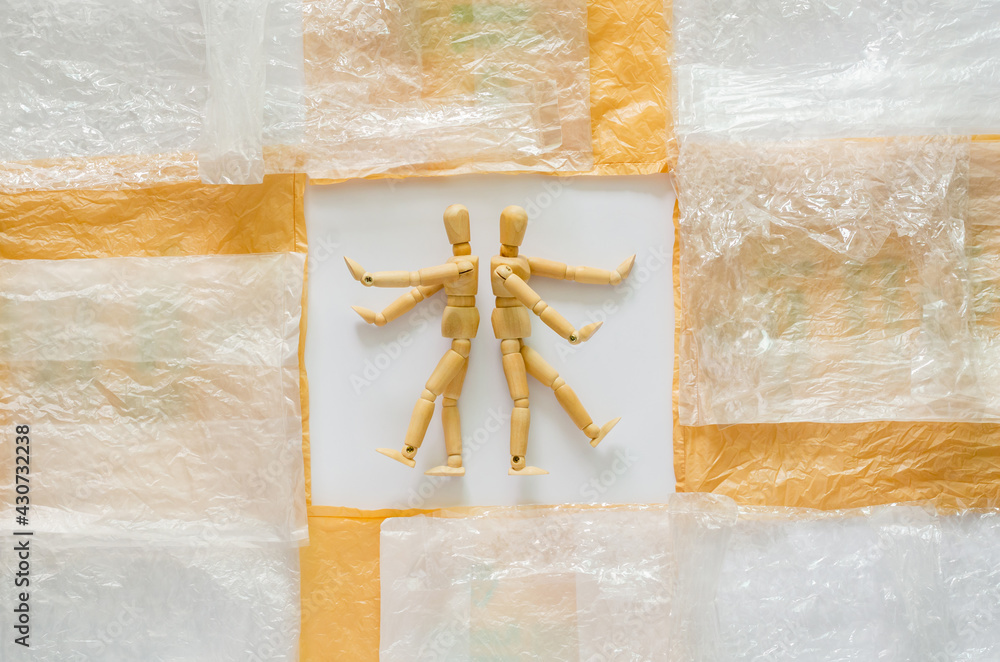 Two wooden models surrounding with many plastic bags. Stop using ...