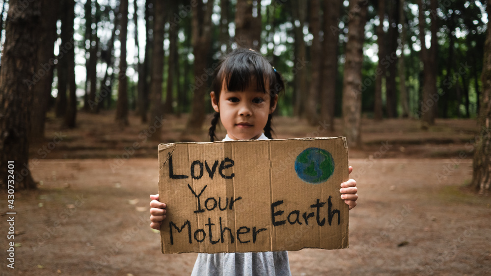 The little child girl with banners protesting over pollution and global ...
