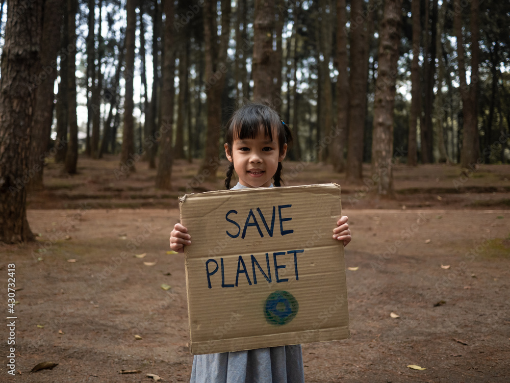 The little child girl with banners protesting over pollution and global ...