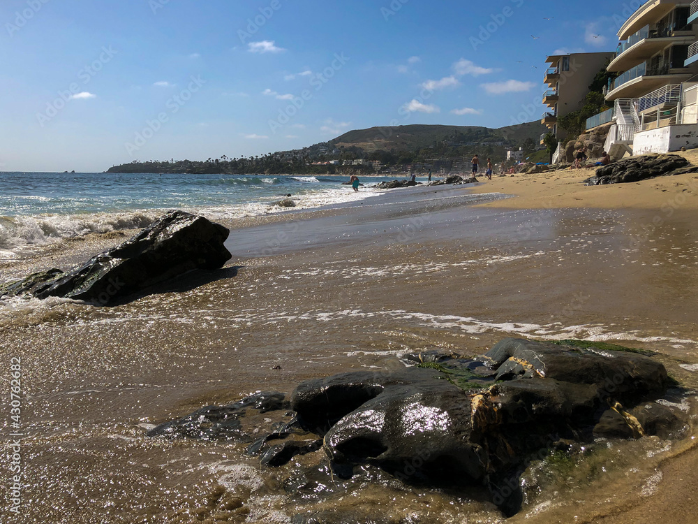Beautiful Californian sandy beach with wake of Pacific Ocean on West ...