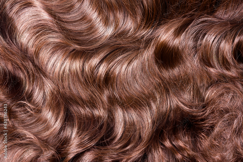 Brown hair texture. Wavy long curly light brown hair close up as ...