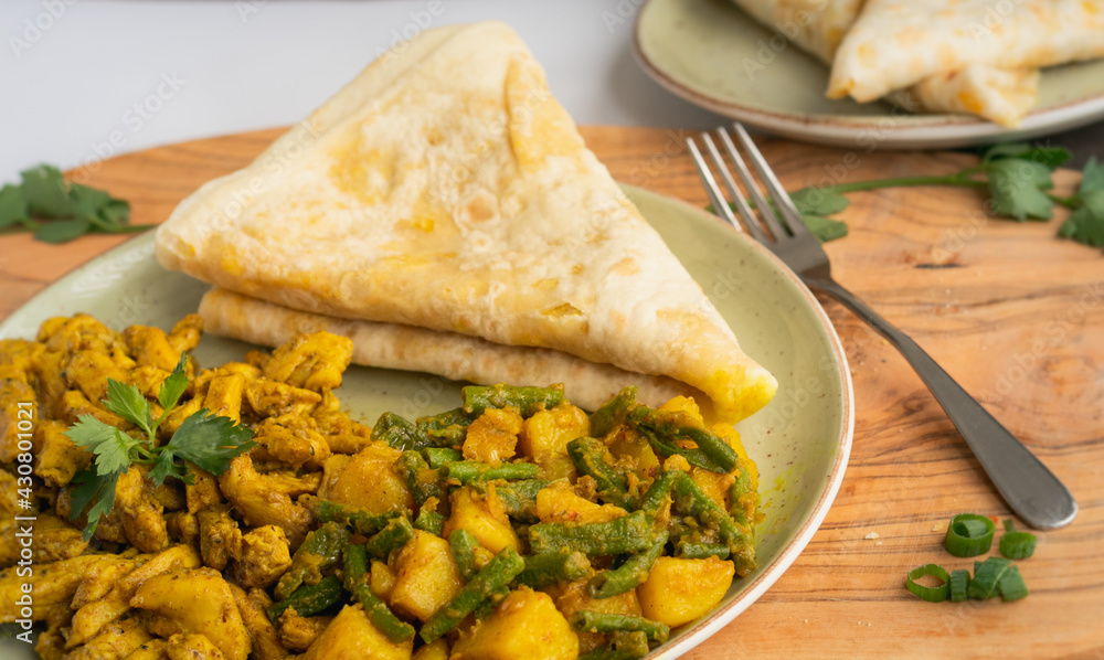 Indian-surinamese spicy food lunch and dinner roti chicken curry meal ...