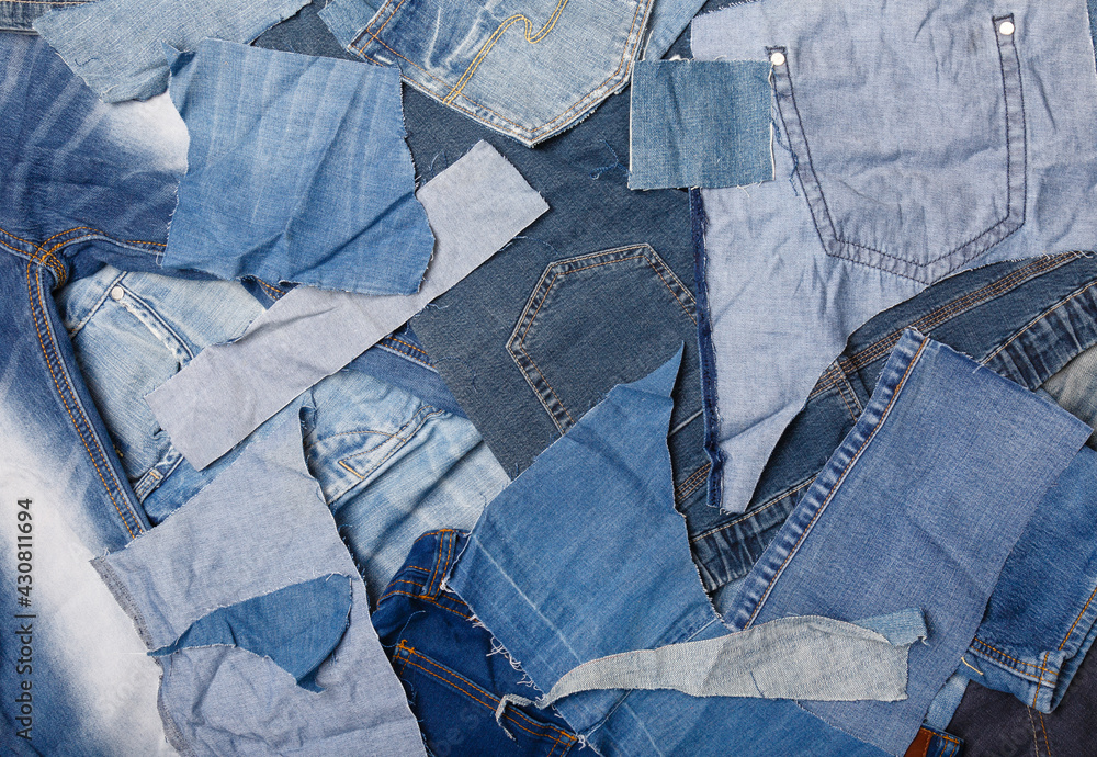 Old denim garbage background. Recycling old jeans. Old blue jeans ready ...