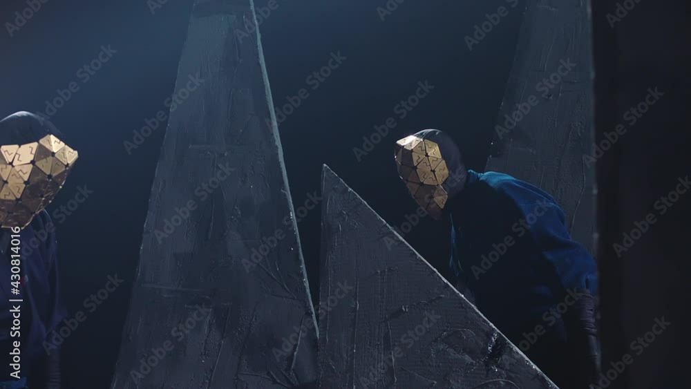 Mystic footage of metal masked man . Epic scene of people with triangle ...