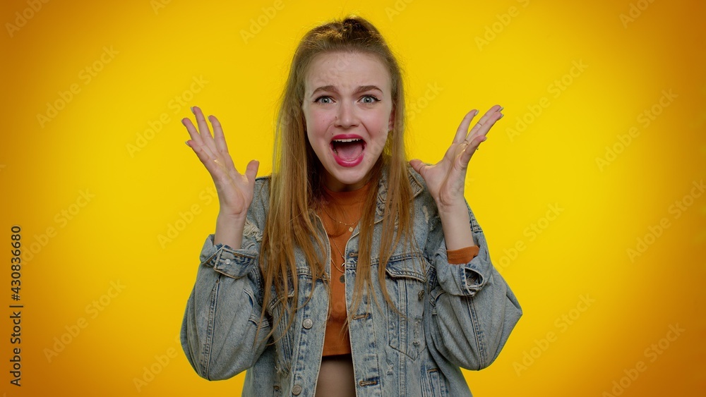 Teenager student girl scared fearful, covering ears with hands, closing ...