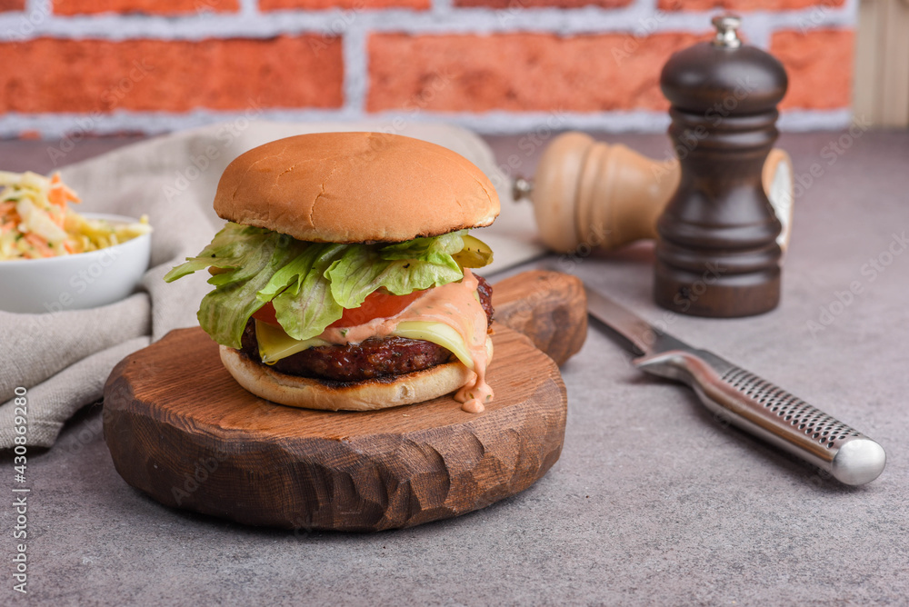 Handmade BBQ Burger of game meat with handmade buns, cheese, handmade ...