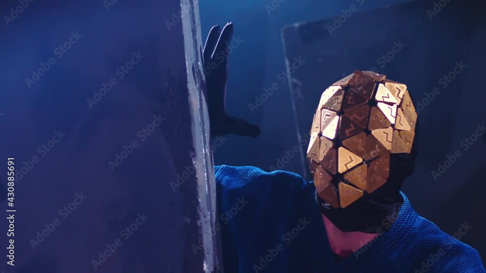 Mystic footage of metal masked man . Epic scene of people with triangle ...
