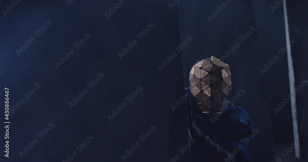 Mystic footage of metal masked man . Epic scene of people with triangle ...